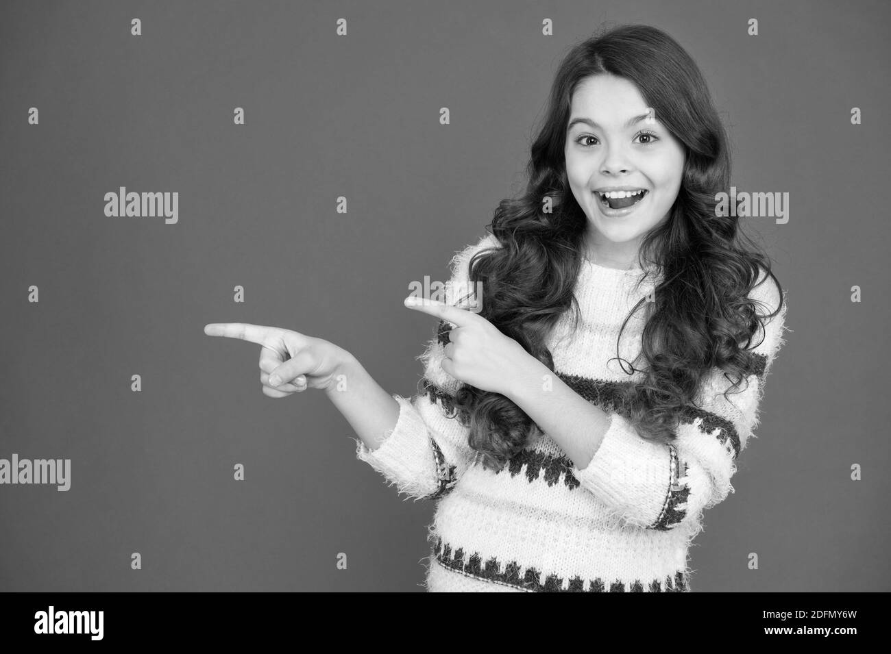 This way. Direction indicator. Happy girl pointing at red background ...