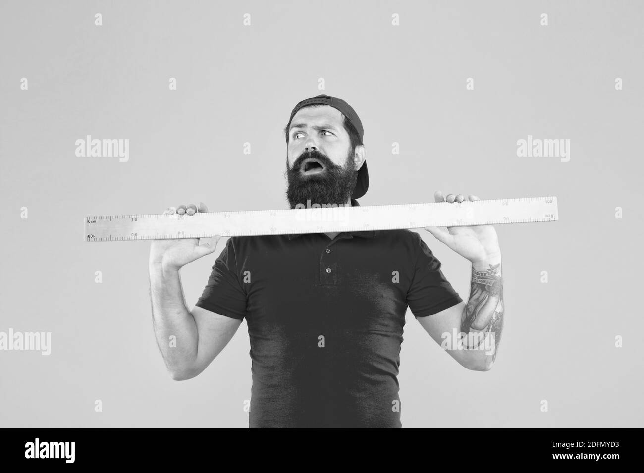 Size of parcel. Post office worker with ruler. Big size. Measuring tool ...