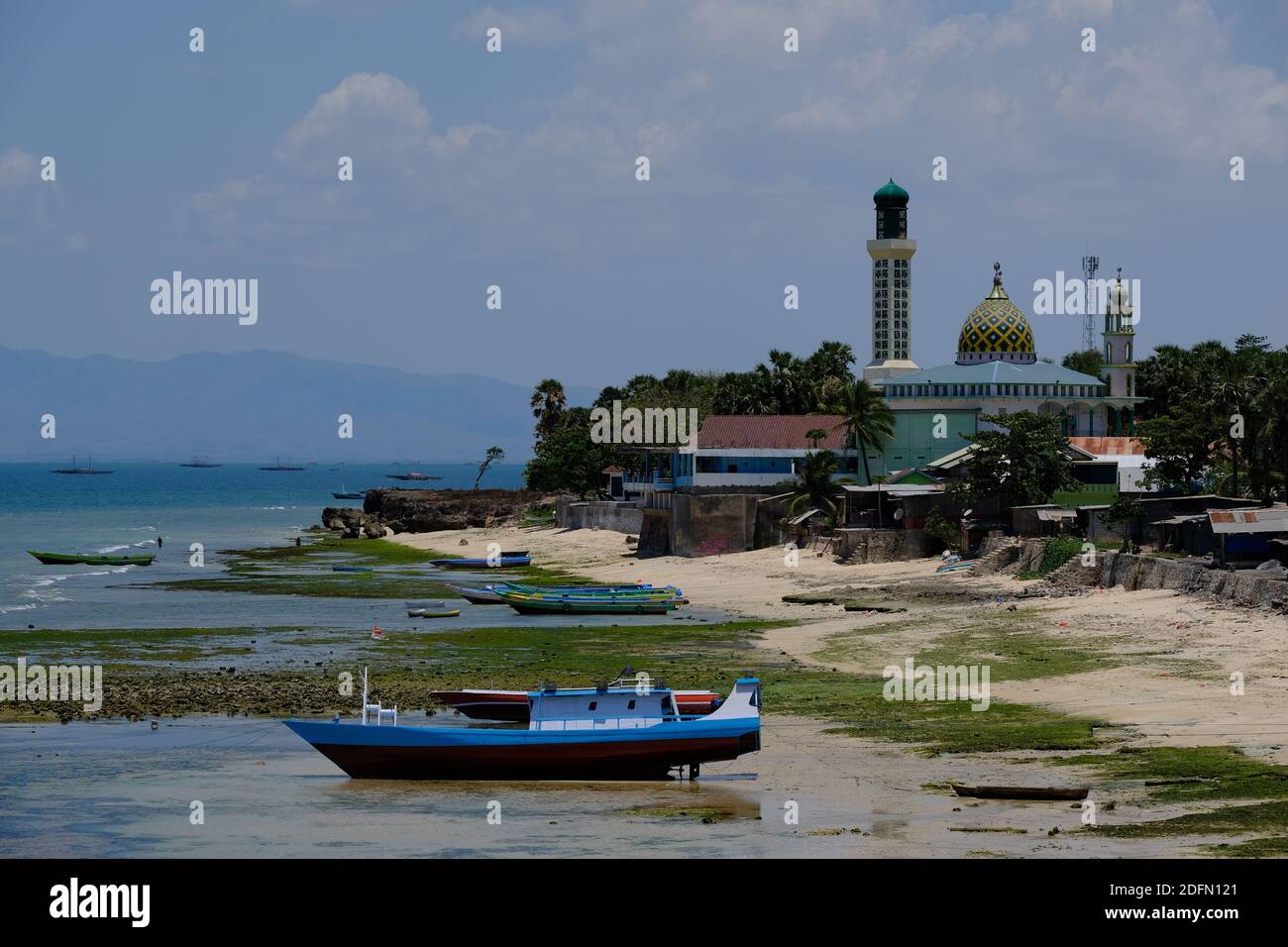 Indonesia Kupang - City Coastline with fishing boats and Mosque Nurul ...
