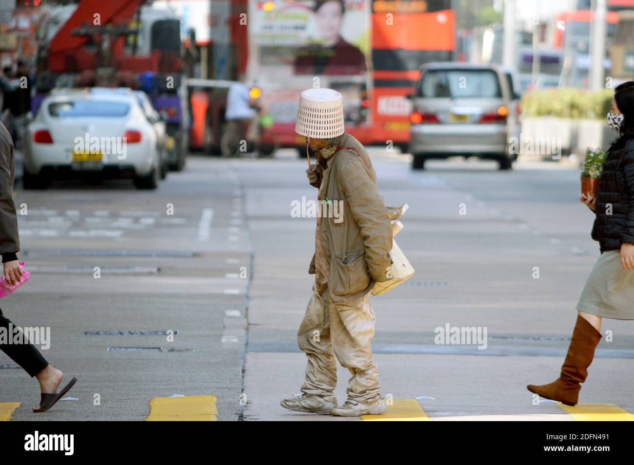 Street person crossing Cheung Sha Wan Road in Sham Shui Po, Kowloon ...