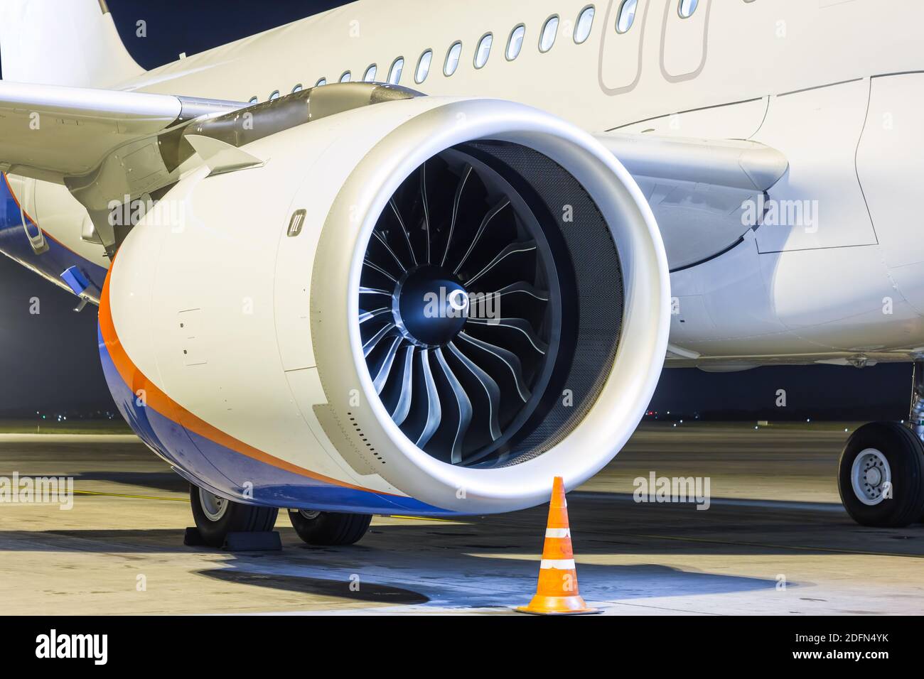 Close-up of engine of big white passenger airplane at night Stock Photo ...
