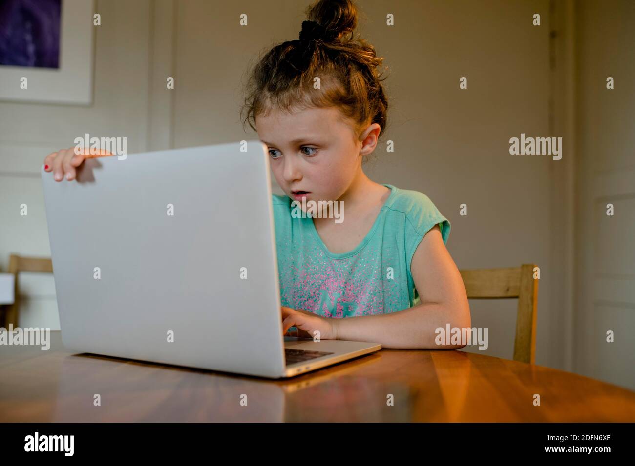 Child sitting at the laptop Stock Photo - Alamy