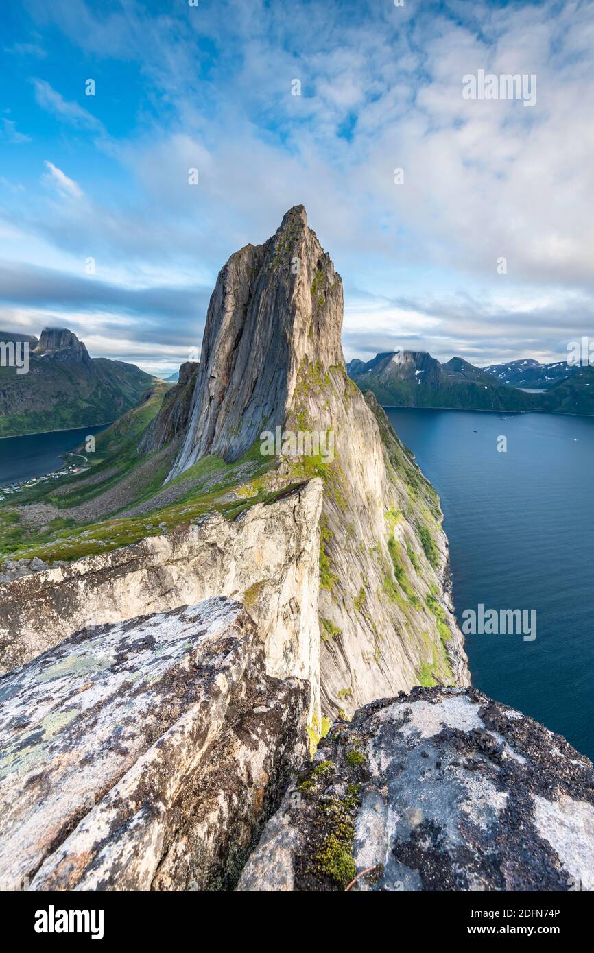 Steep mountain Segla, fjord Mefjorden with mountains, island Senja ...