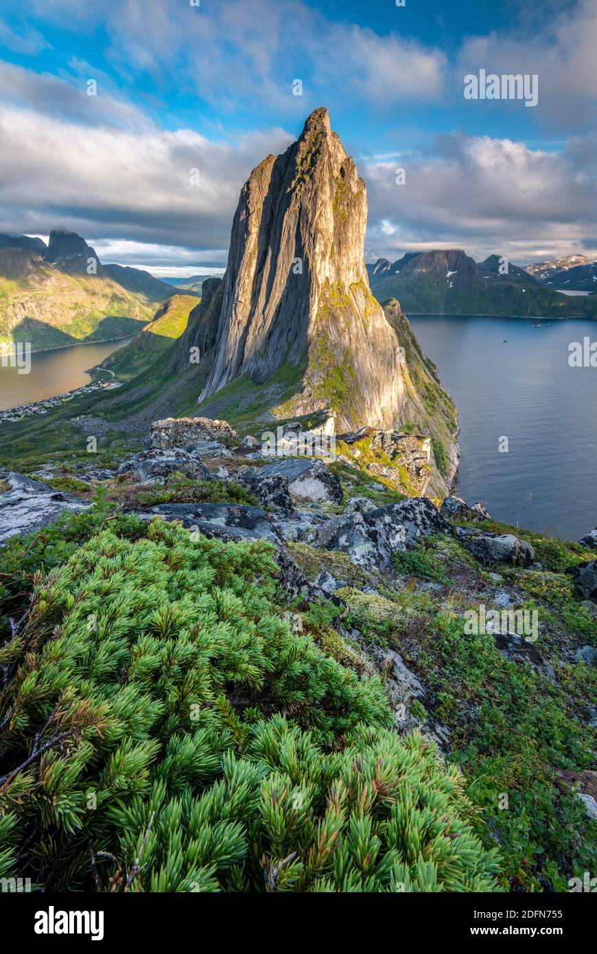 Steep mountain Segla, fjord Mefjorden with mountains, island Senja ...