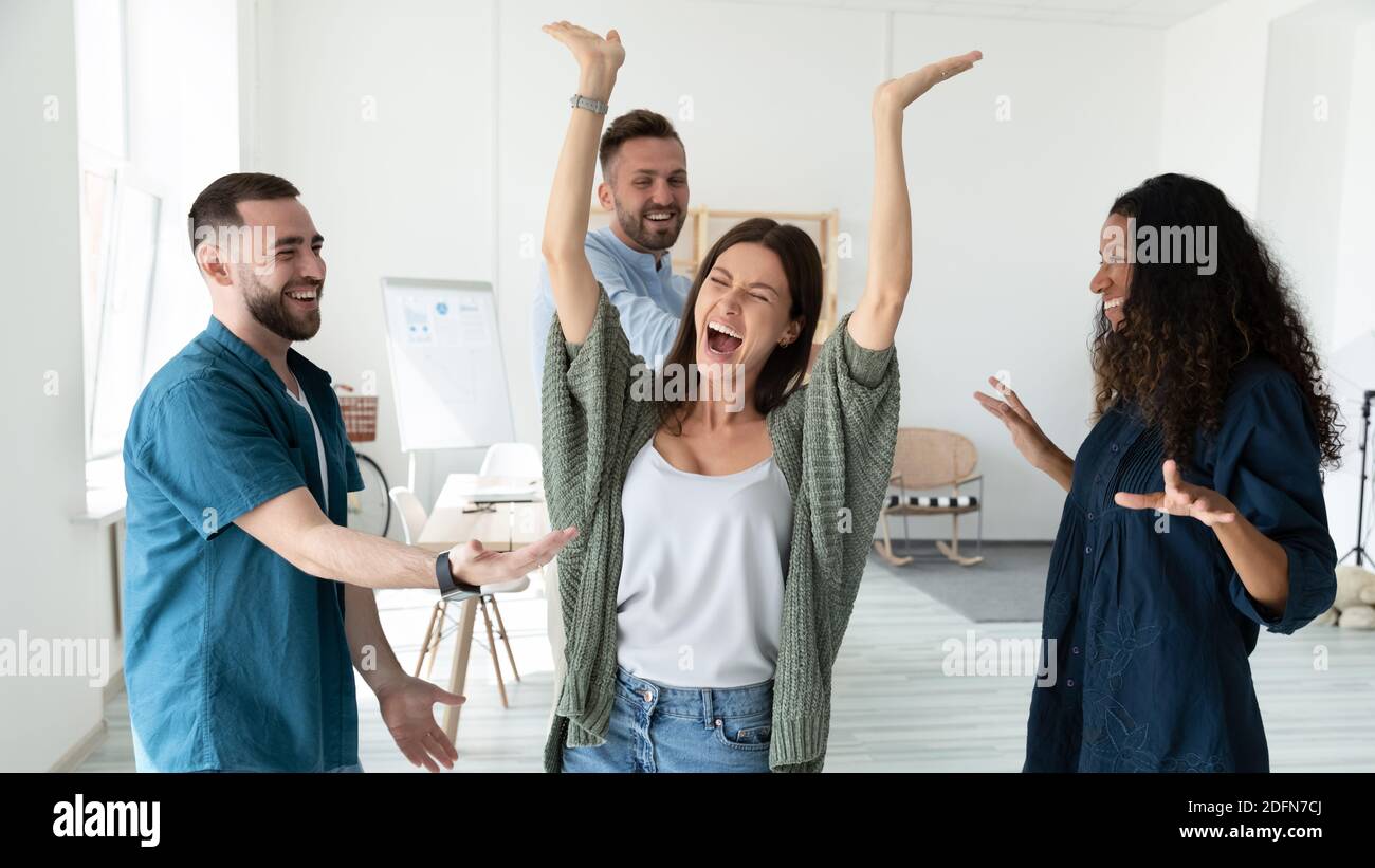 Banner view of excited diverse colleagues dance in office Stock Photo ...