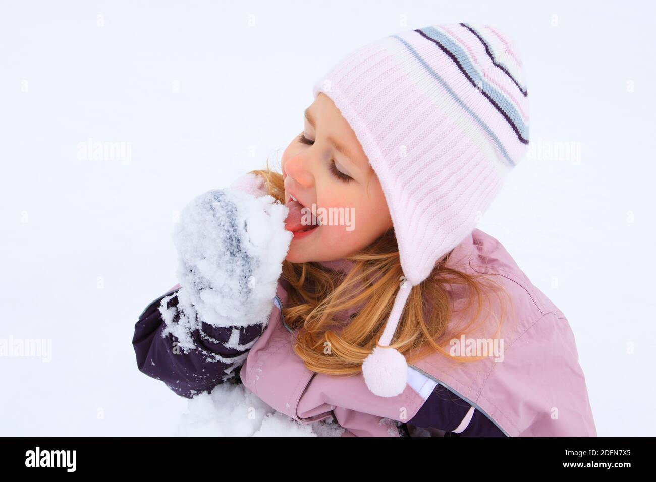 Girl in the snow, Switzerland Stock Photo - Alamy