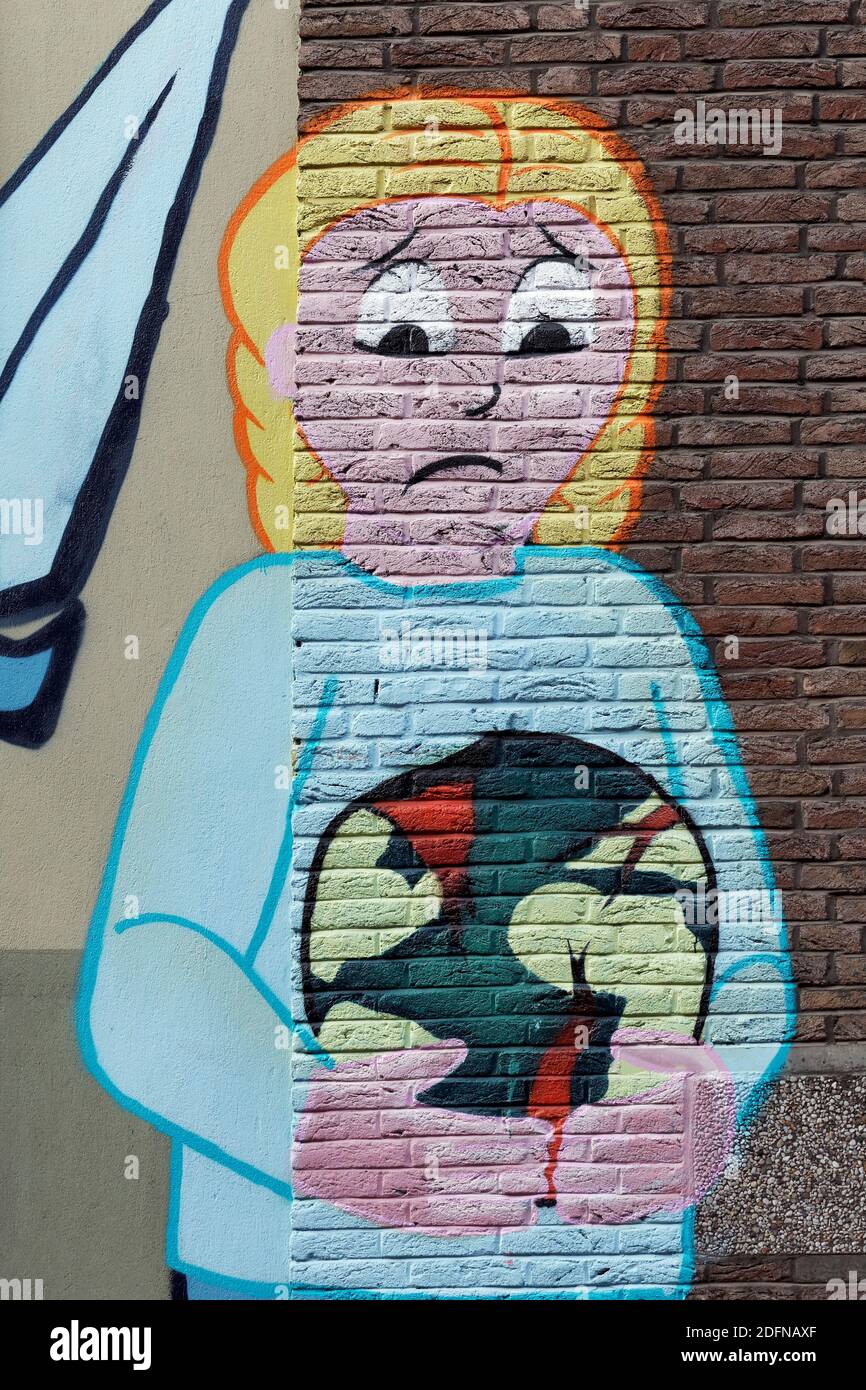 Graffito, child with sad face holds globe, earth in flames ...