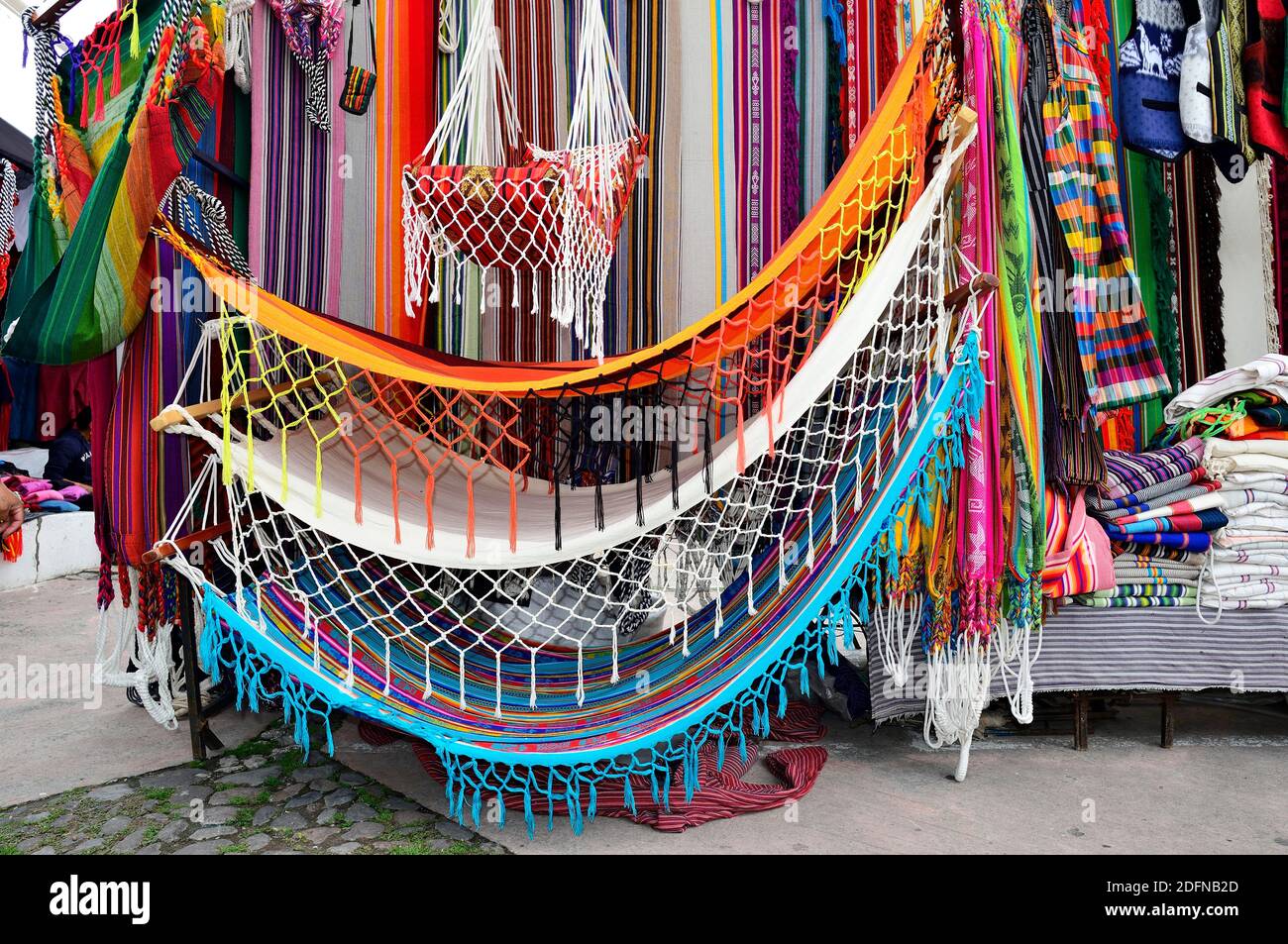 Colourful textiles and hammocks at the handicraft market, Plaza de los ...