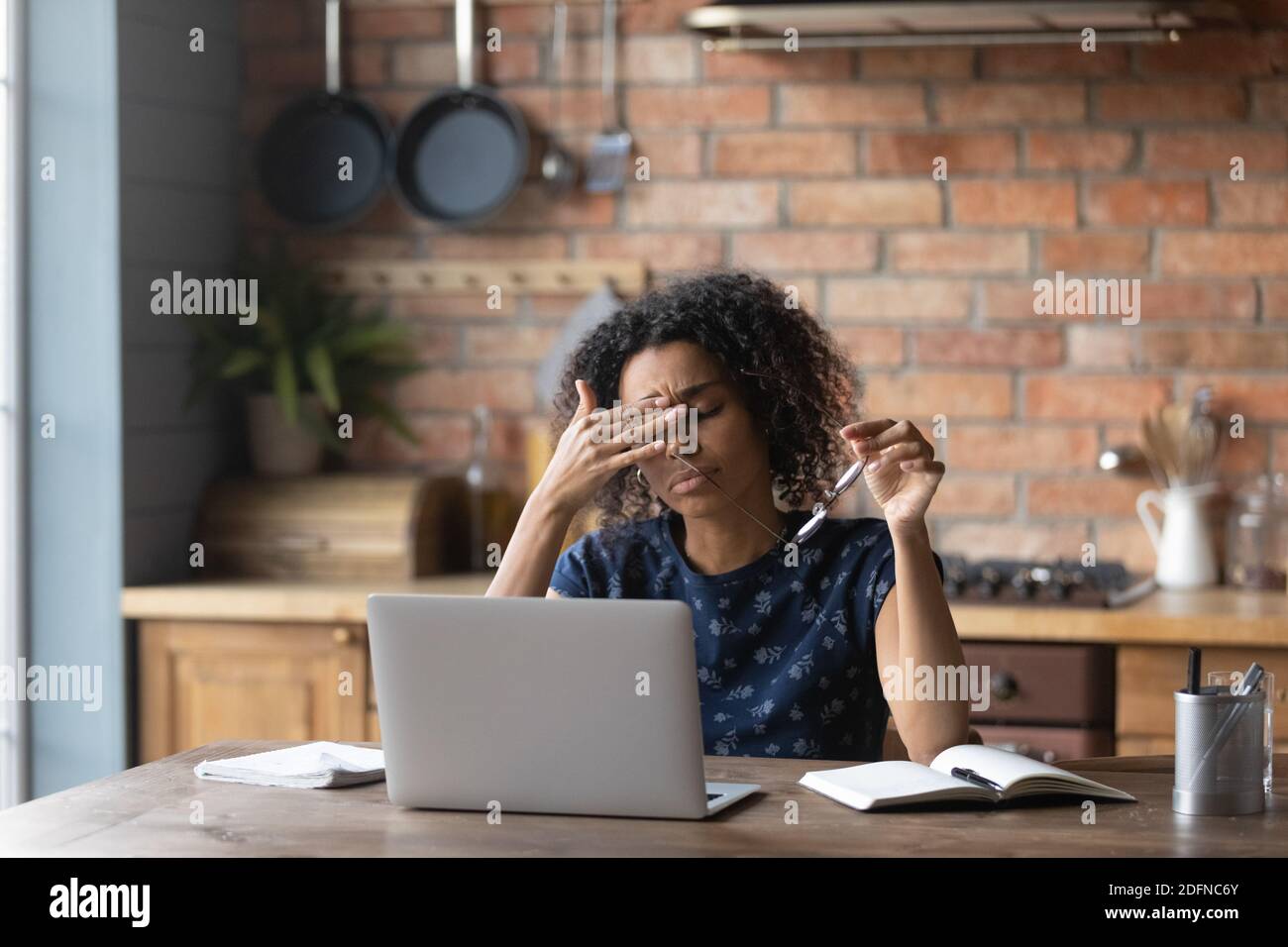 Unhappy young african american woman taking off eyeglasses, feeling ...