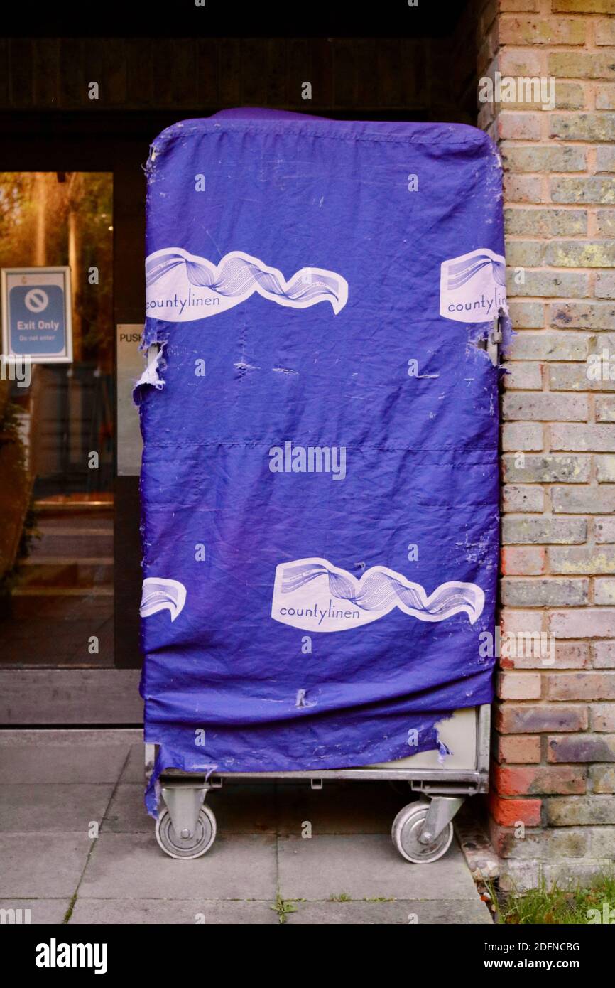 7 November 2020 - England, UK: Covered wheeled linen trolley Stock ...