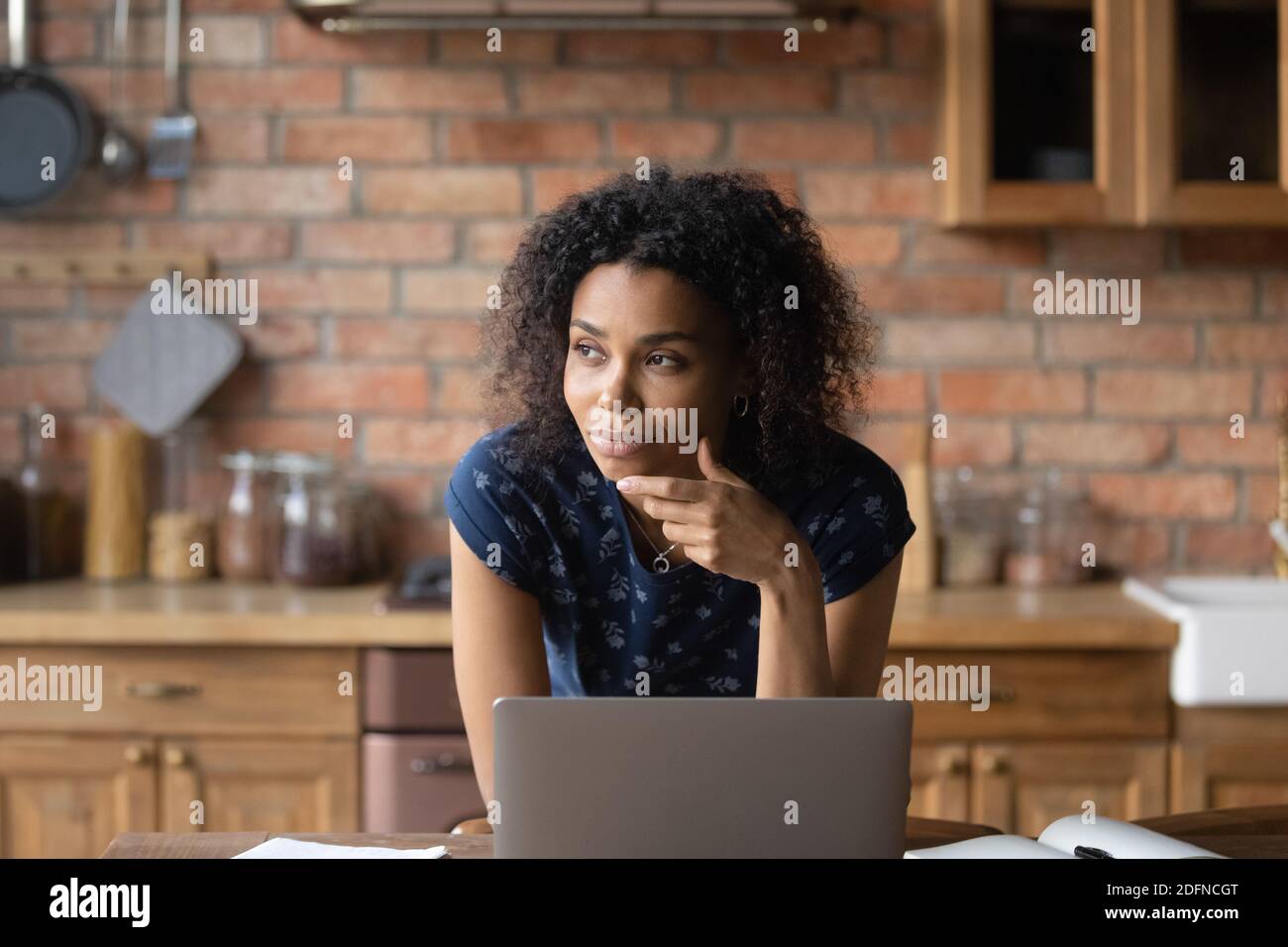 Happy ethnic lady lost in thoughts, vision concept Stock Photo - Alamy