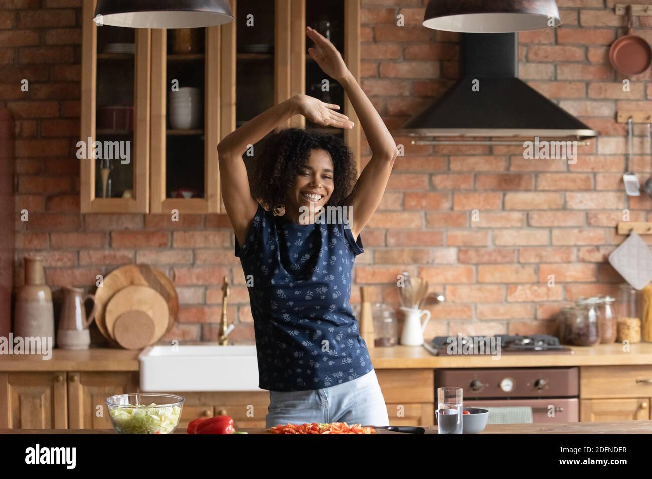 Woman dancing in kitchen hi-res stock photography and images - Alamy