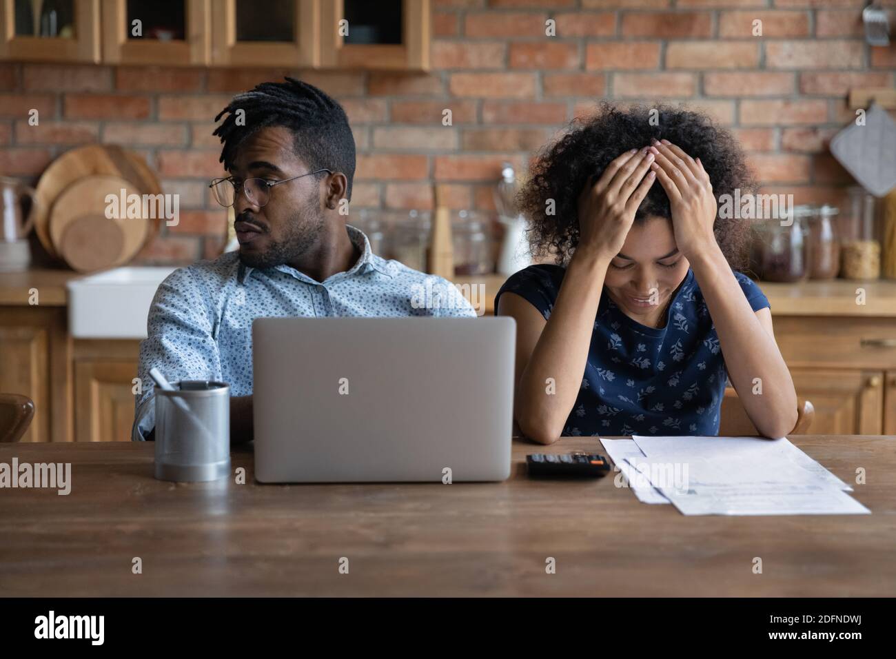 Stressed young married african ethnicity couple having financial ...