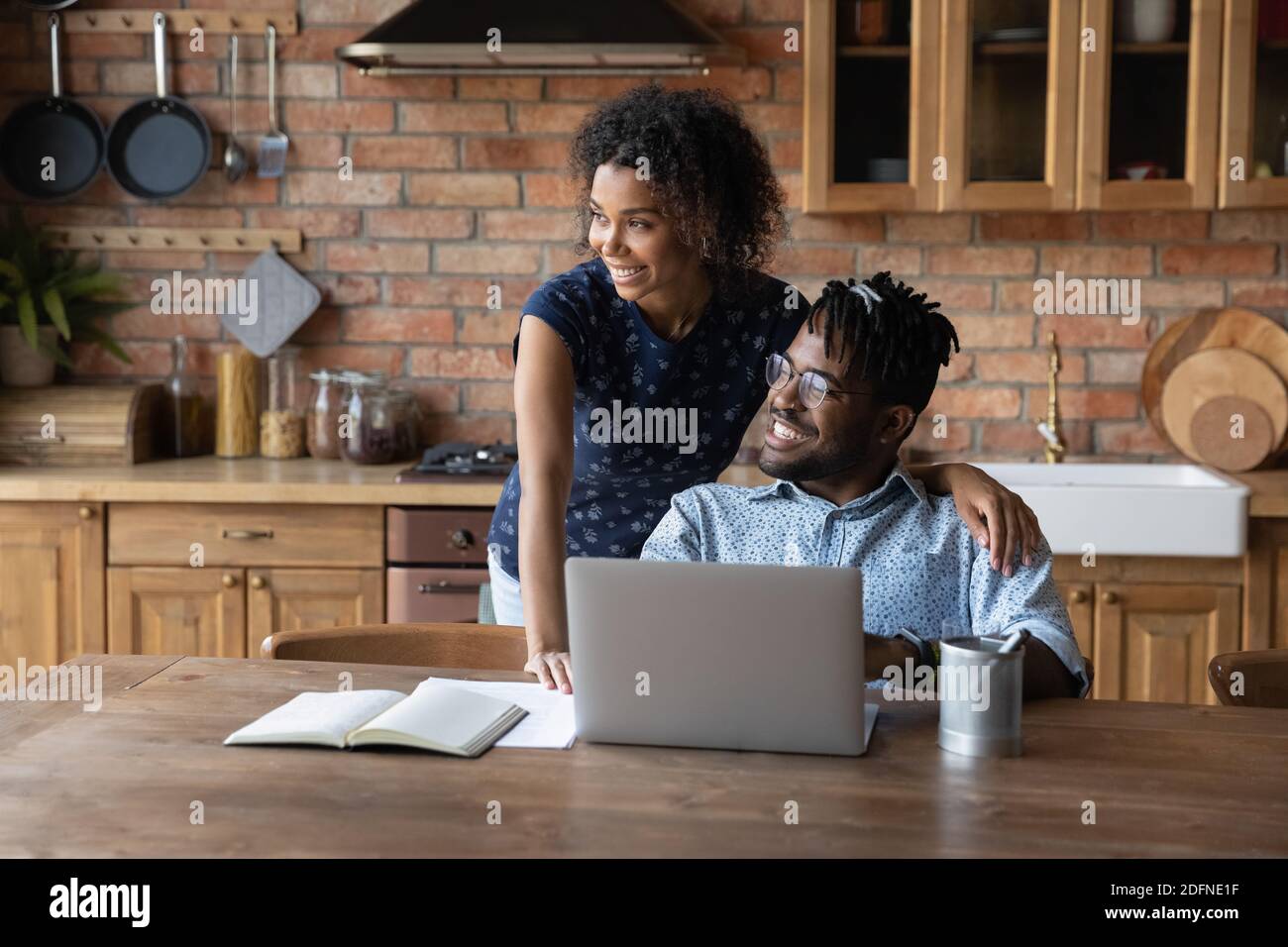 Dreamy happy young african ethnicity couple dreaming together Stock ...