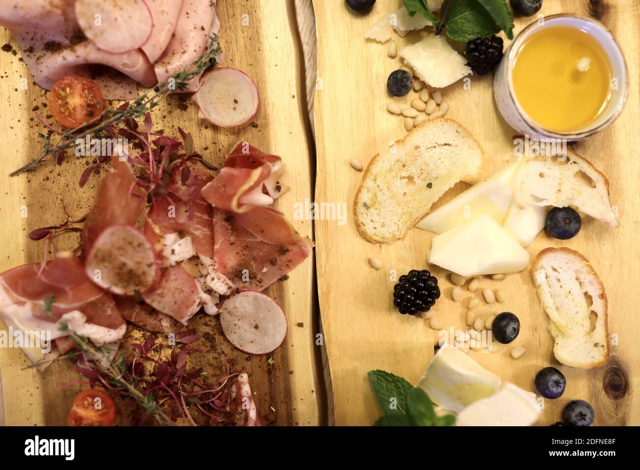 Cheese and ham boards in italian restaurant Stock Photo - Alamy