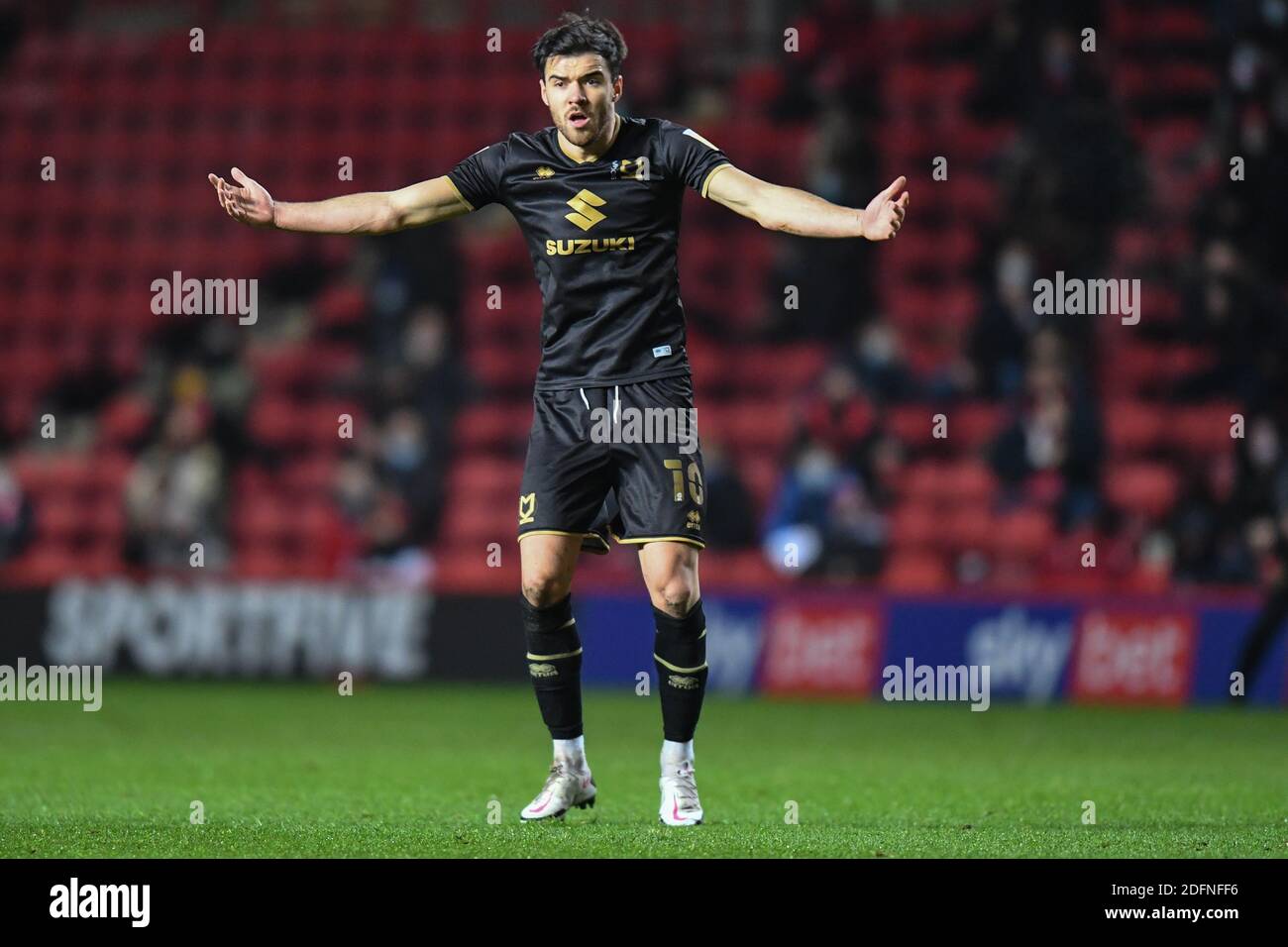 Scott Fraser #10 of Milton Keynes Dons complains to the referee Stock ...