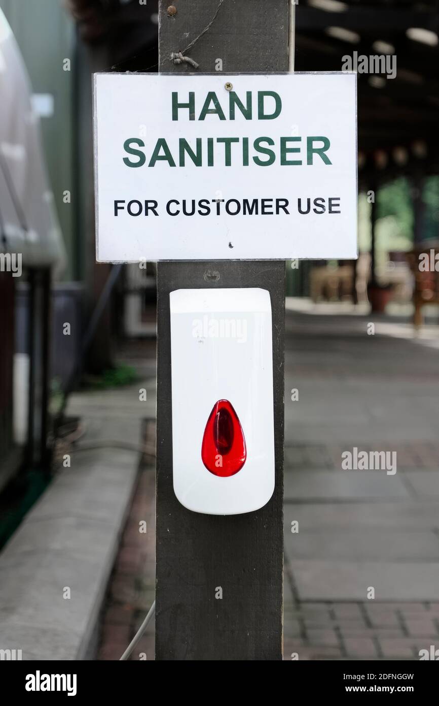 Hand sanitiser dispenser for customer use to wash hands reduce risk of ...