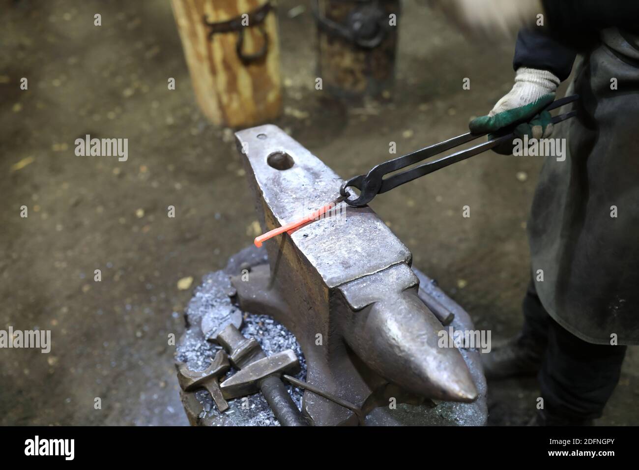 Blacksmith forges hot iron in the forge Stock Photo - Alamy