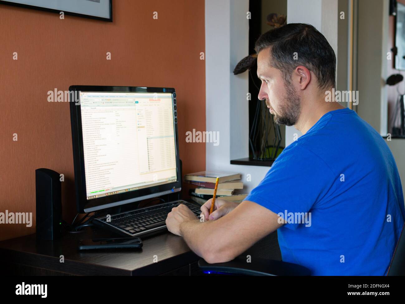 Sitting writing computer monitor technology learning education hi-res ...