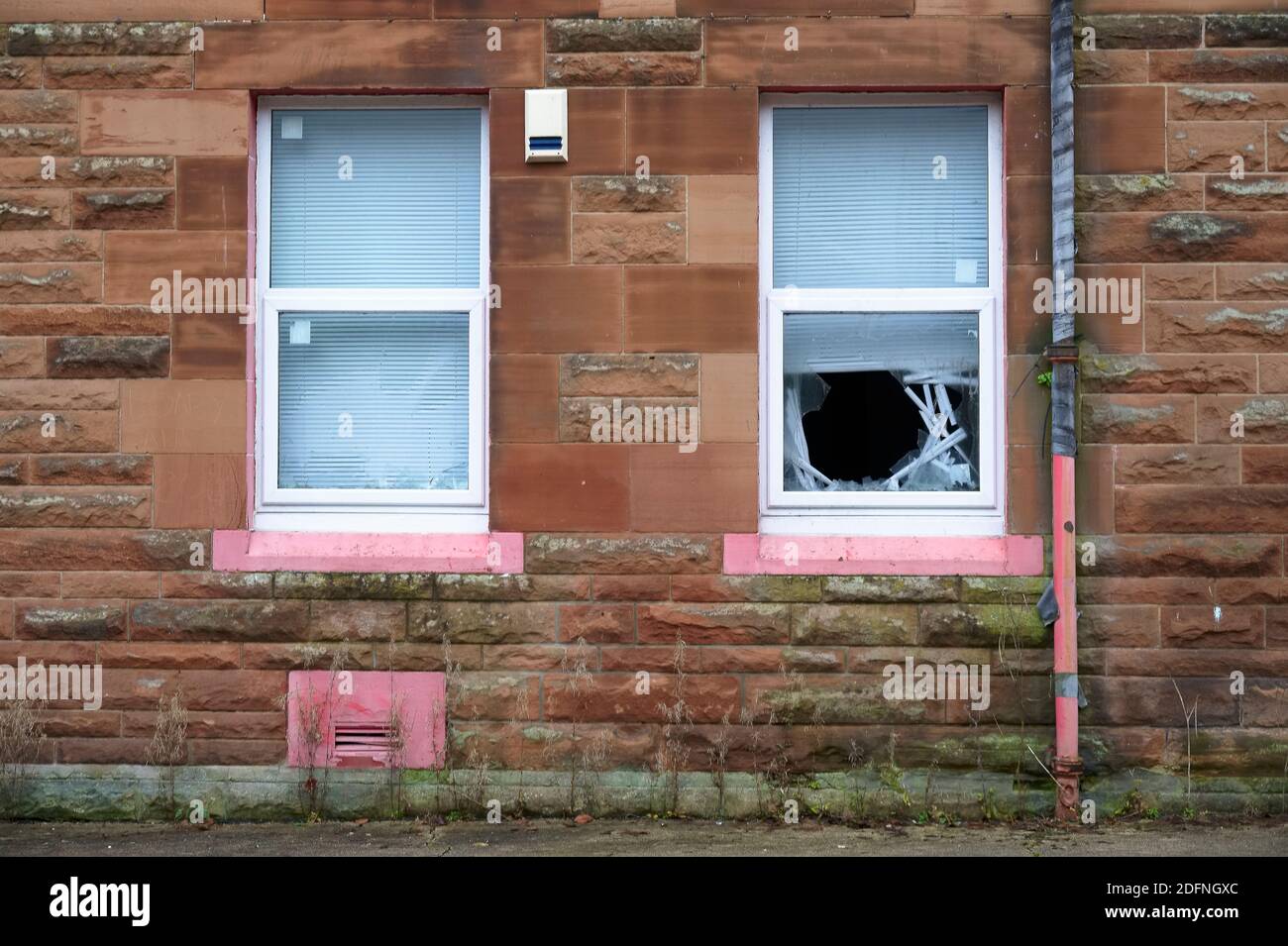 Derelict council house in poor housing estate slum with many social ...