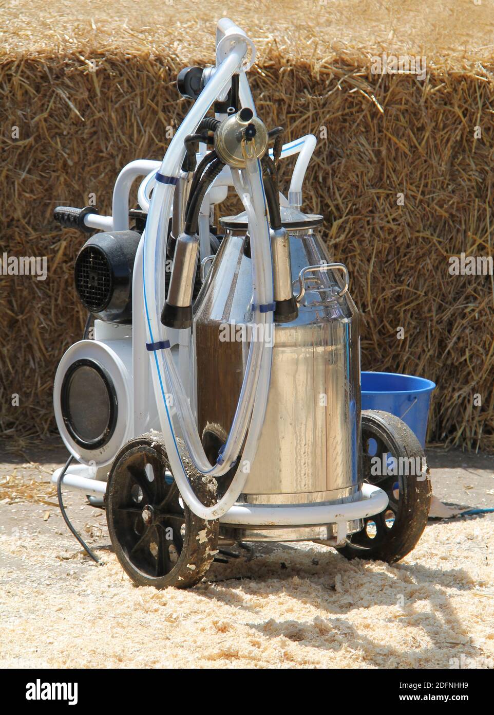 A Mobile Cow Milking Machine Unit in a Farmyard Setting Stock Photo - Alamy
