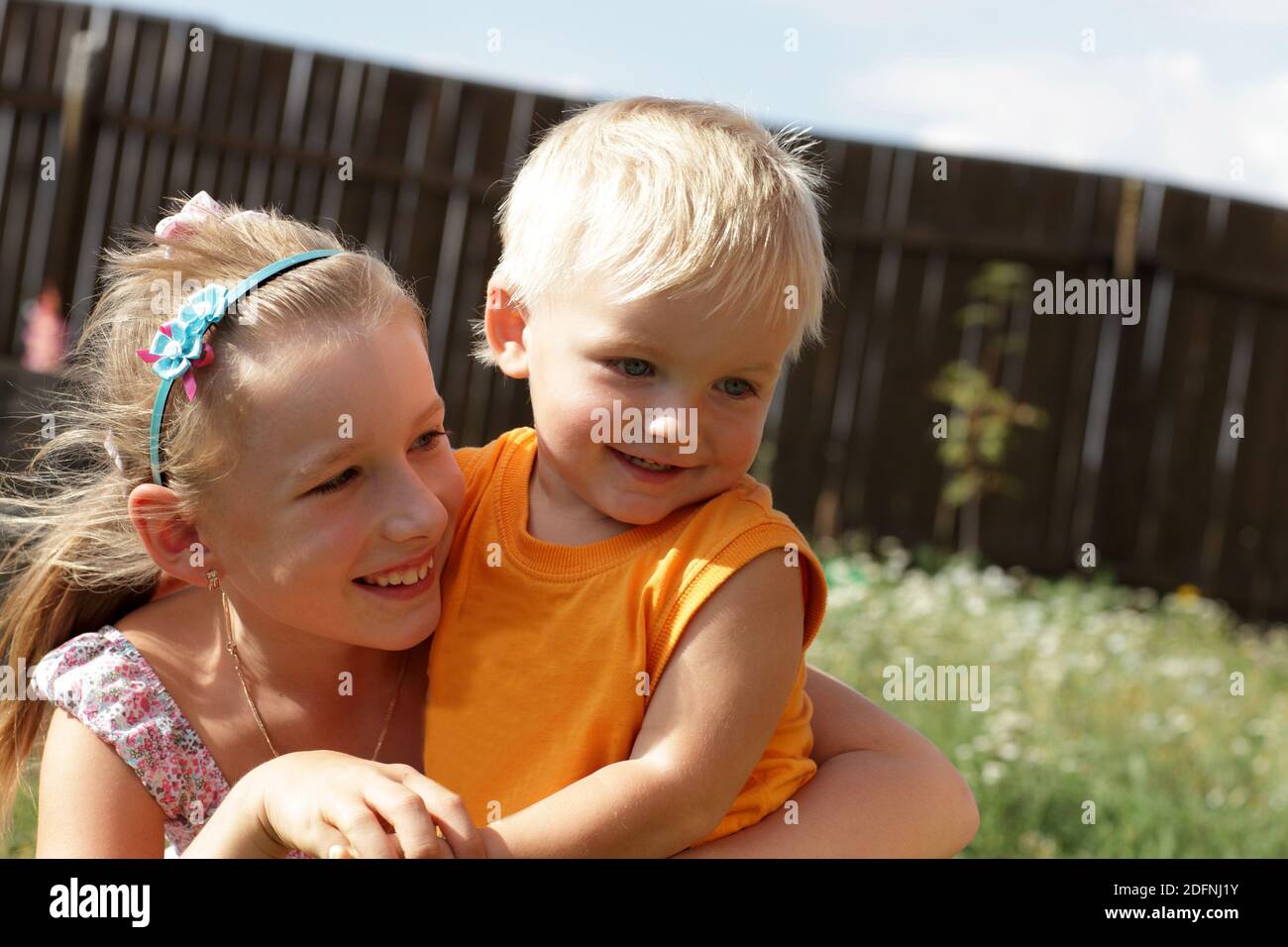 The happy sister and brother pose outdoor Stock Photo - Alamy