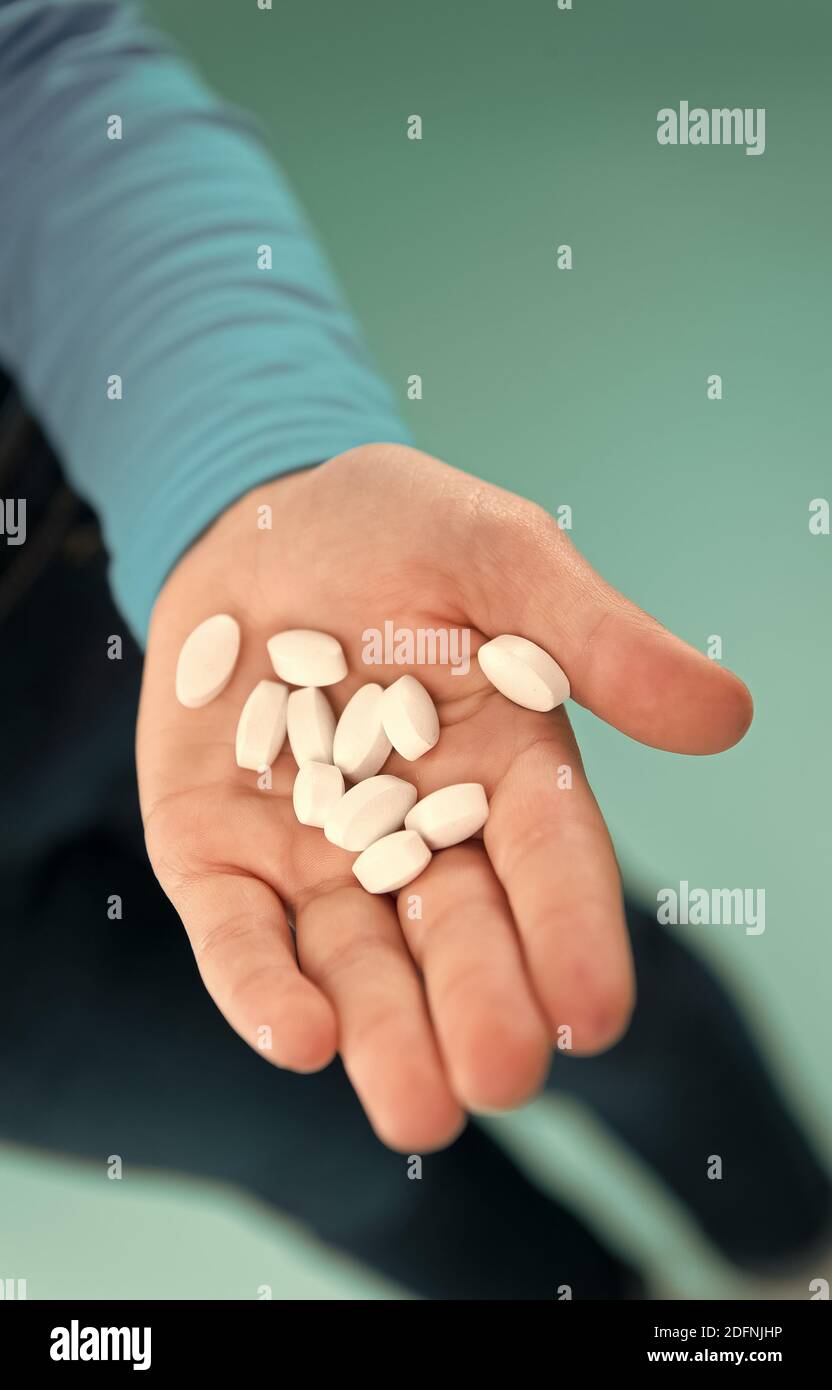 Take your pills. Pills on human hand. Prescribed and dispensed pills ...