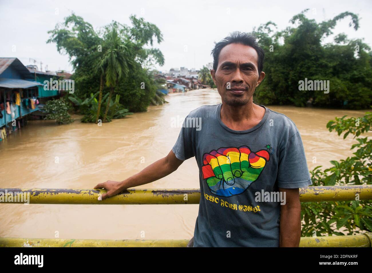 A resident, Andrianto (45) seen on portrait with the background as ...