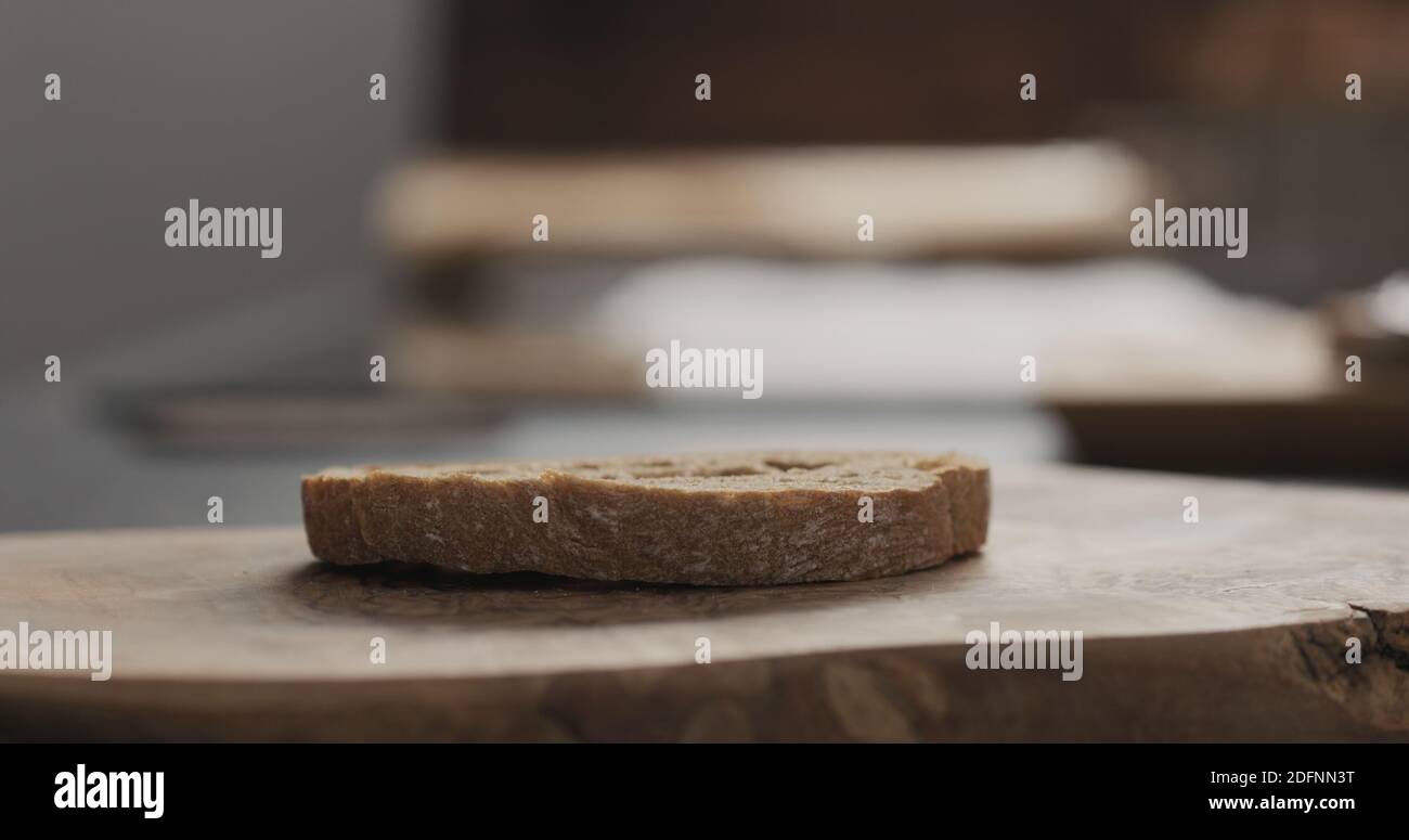 rustic ciabatta slice on wood board, wide photo Stock Photo - Alamy