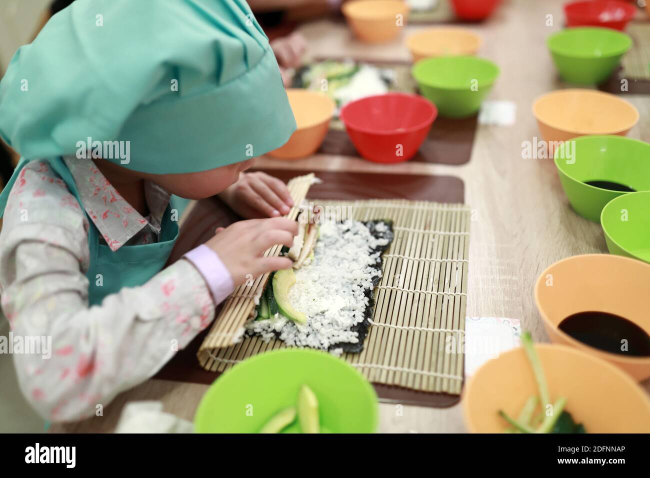 Boy eating sushi roll hi-res stock photography and images - Alamy