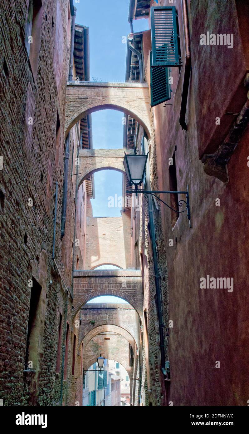 Ancient alley in Siena - Italy Stock Photo - Alamy