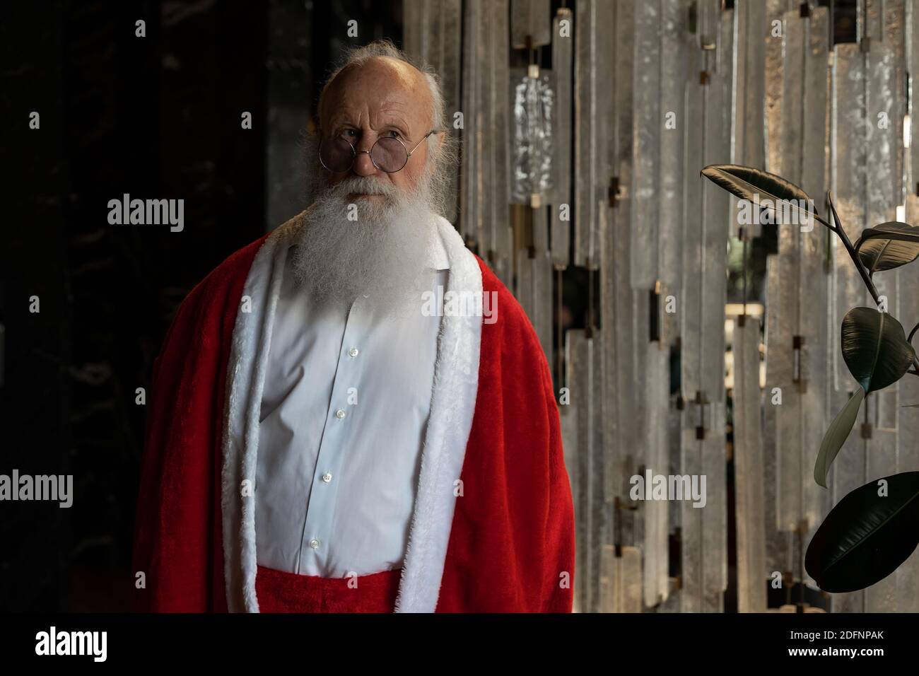 old santa claus with a sad look in retirement Stock Photo - Alamy