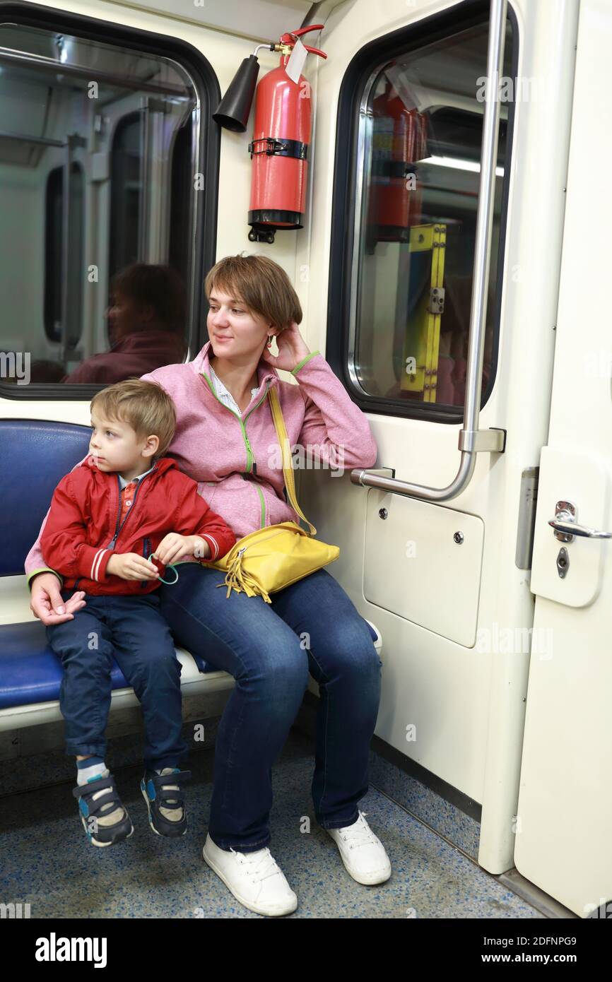 Portrait of mother and her son in subway train Stock Photo - Alamy