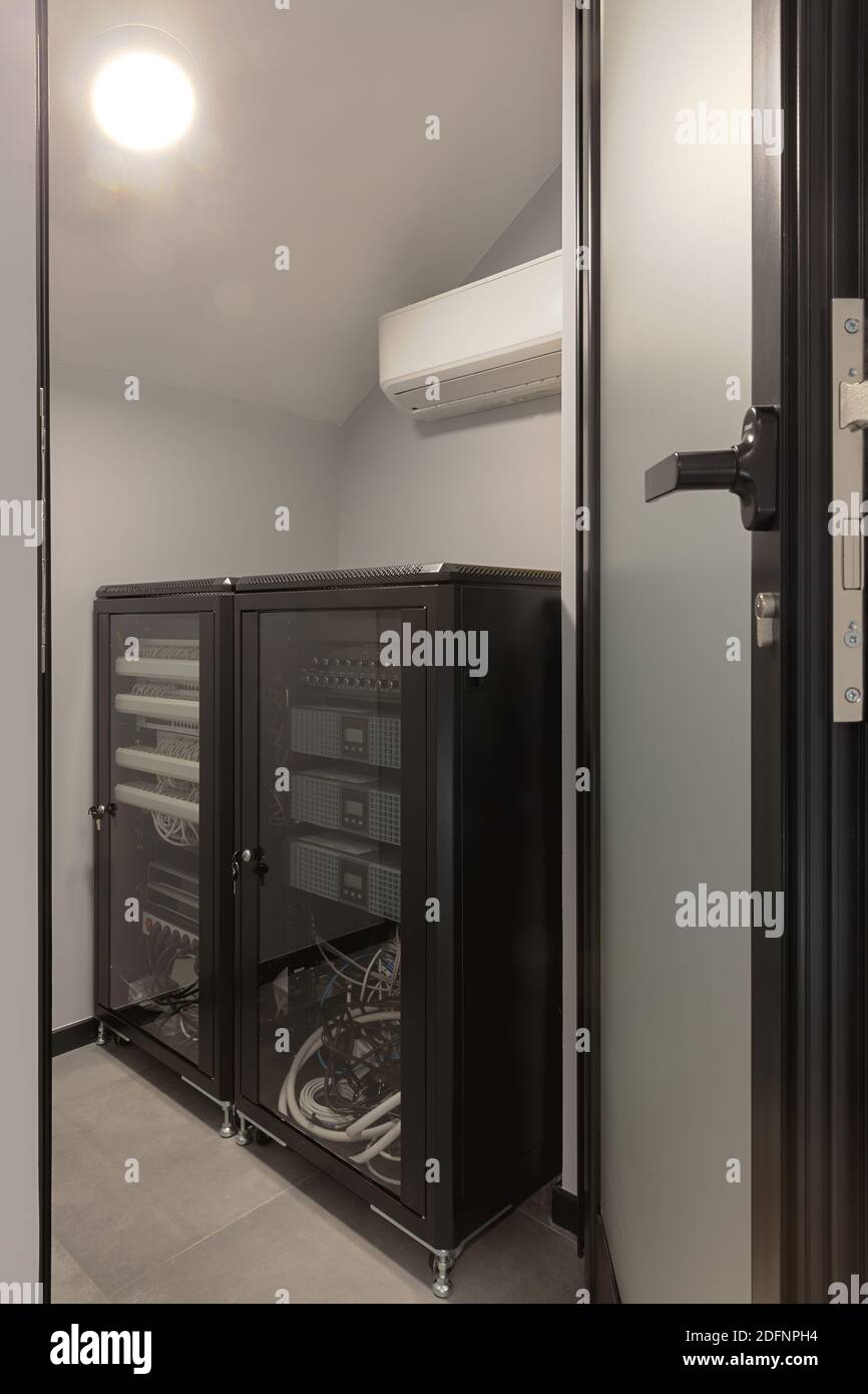 Modern rack of equipment for internet and multimedia devices installed ...