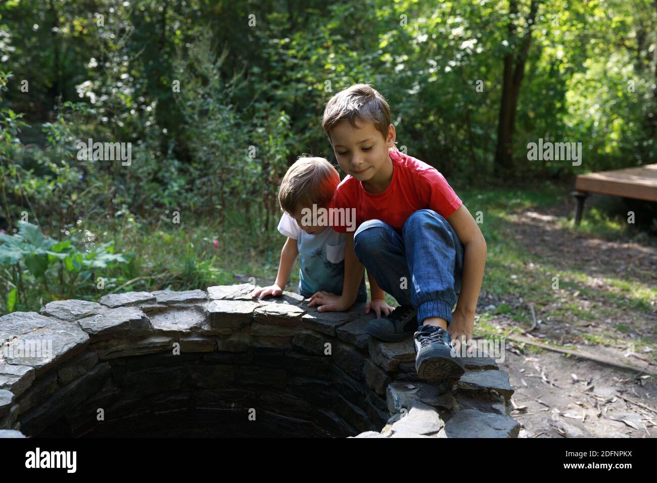 Child stone look grass hi-res stock photography and images - Alamy