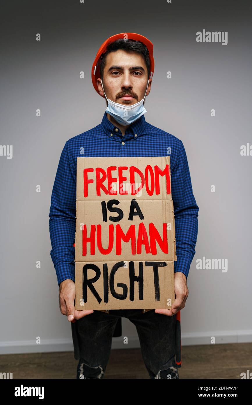 'Freedom is a human right' placard in hands of protester man Stock ...