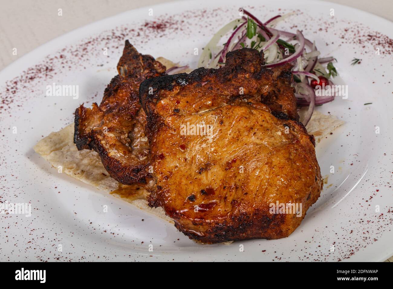 Grilled pork lion shashlik barbeque served onion Stock Photo - Alamy