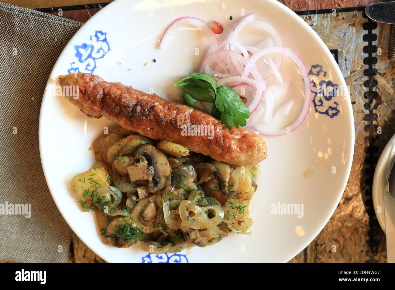 Lyulya kebab with fried mushrooms and onions Stock Photo - Alamy
