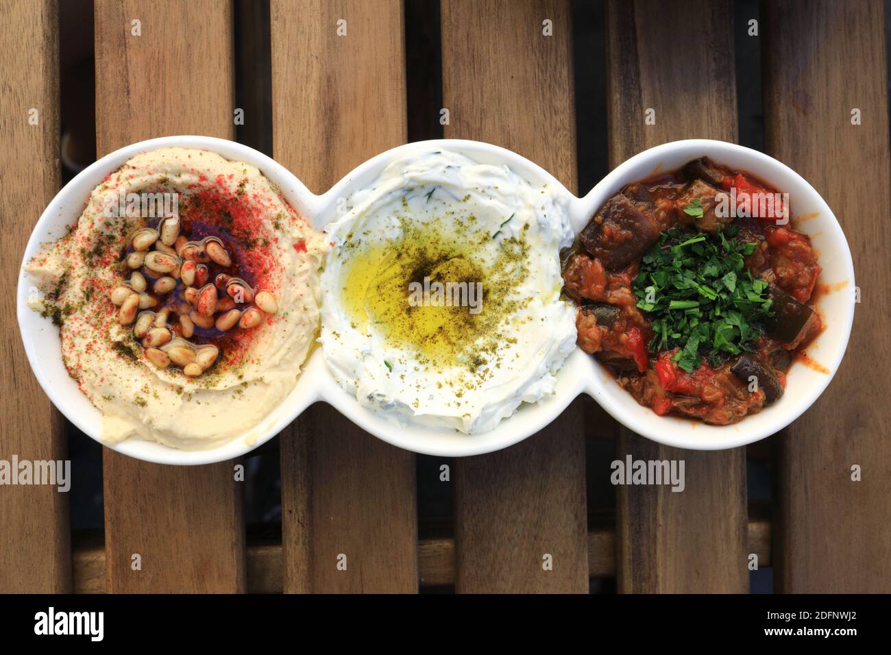 Israeli appetizer set - matbucha with eggplant, labneh with zaatar and ...