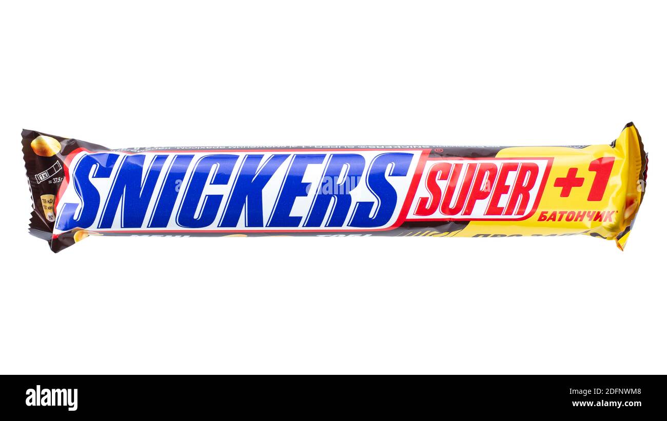 Ukraine, Kyiv - November 30. 2020: Snickers Super chocolate bar ... Ukraine, Kyiv - November 30. 2020: Snickers Super chocolate bar ...
