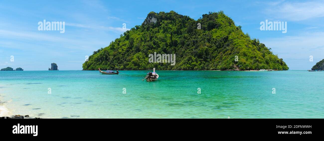 Small exotic island covered in trees Stock Photo - Alamy
