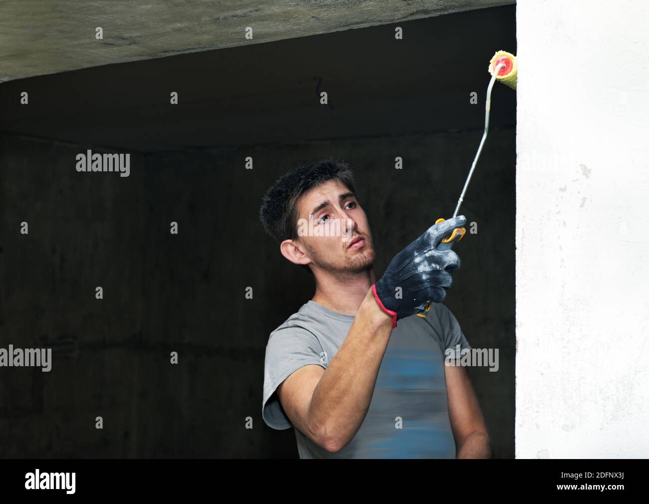 Boy works wall painting hi-res stock photography and images - Alamy