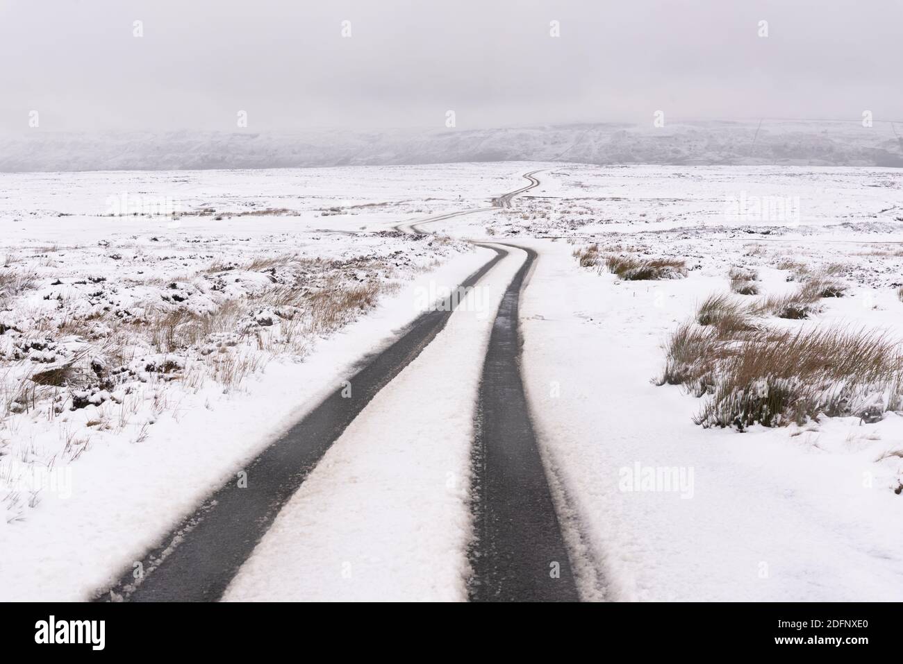 Road through the snow Stock Photo - Alamy