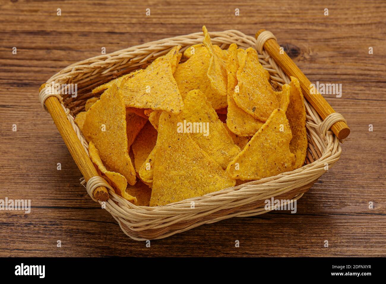 Mexican crunchy corn nachos triangle heap Stock Photo - Alamy