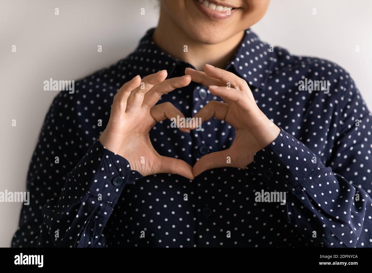 Happy young woman put fingers in heart shape express love Stock Photo ...