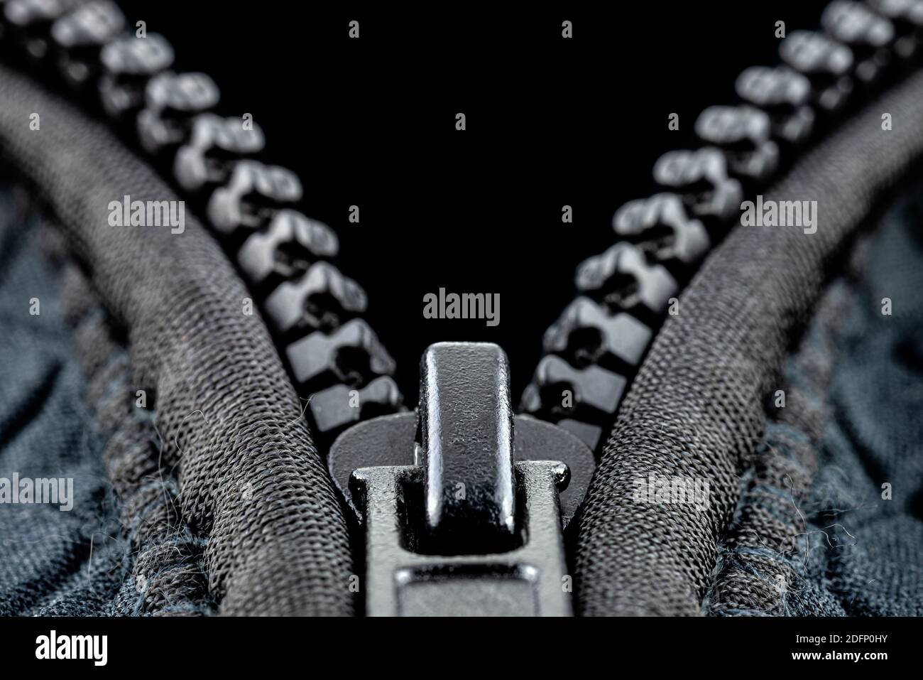 A macro shot of a open, plastic zipper in a modern blue garment Stock ...