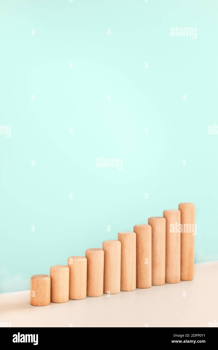 Growth bar chart, graph diagram made with wooden block on blue ...