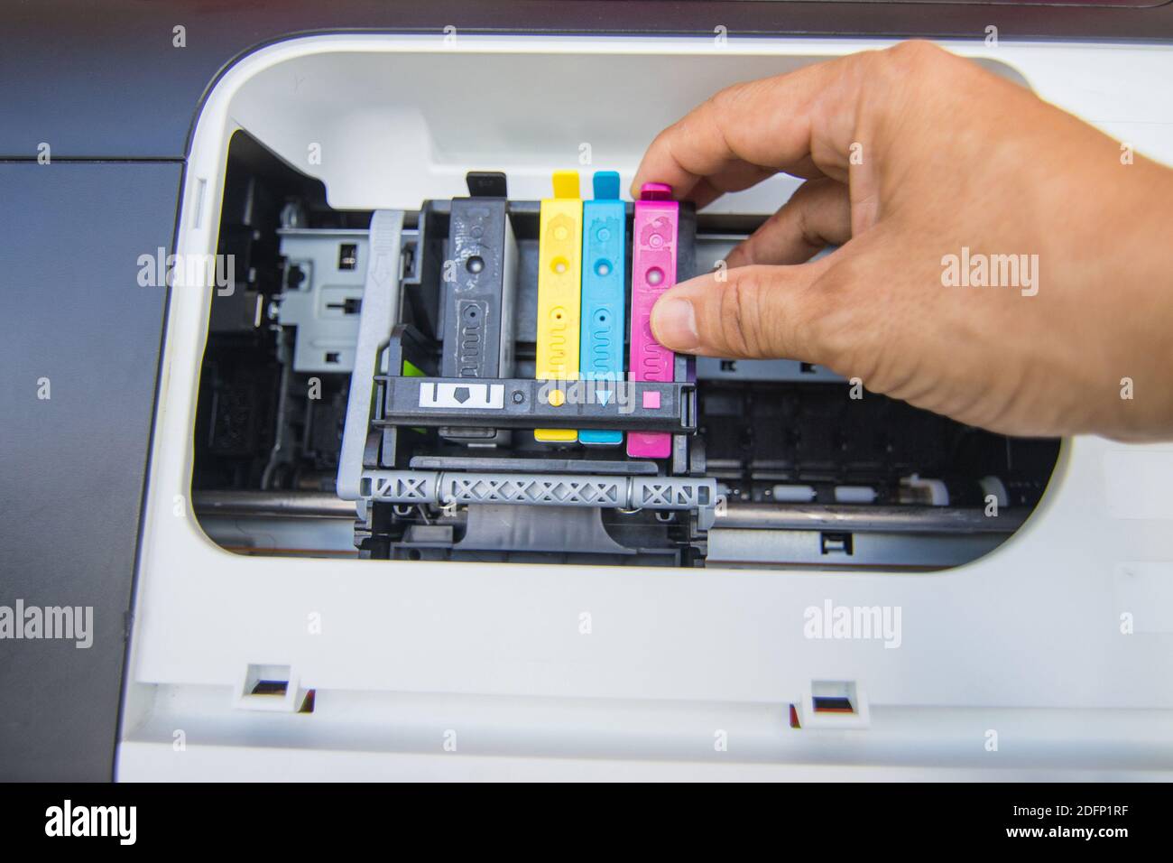 Technicians are install setup the ink cartridge of a inkjet printer the ...