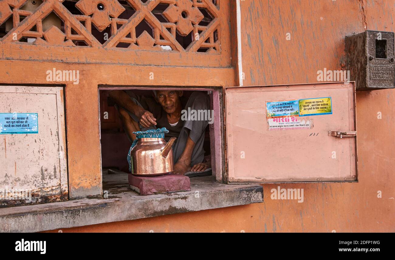 Indian man looking out from his tea portal, Jaipur, Rajasthan, India ...