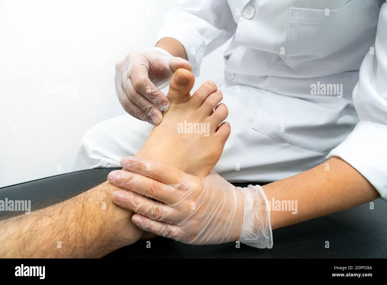 Doctor examining foot hi-res stock photography and images - Alamy